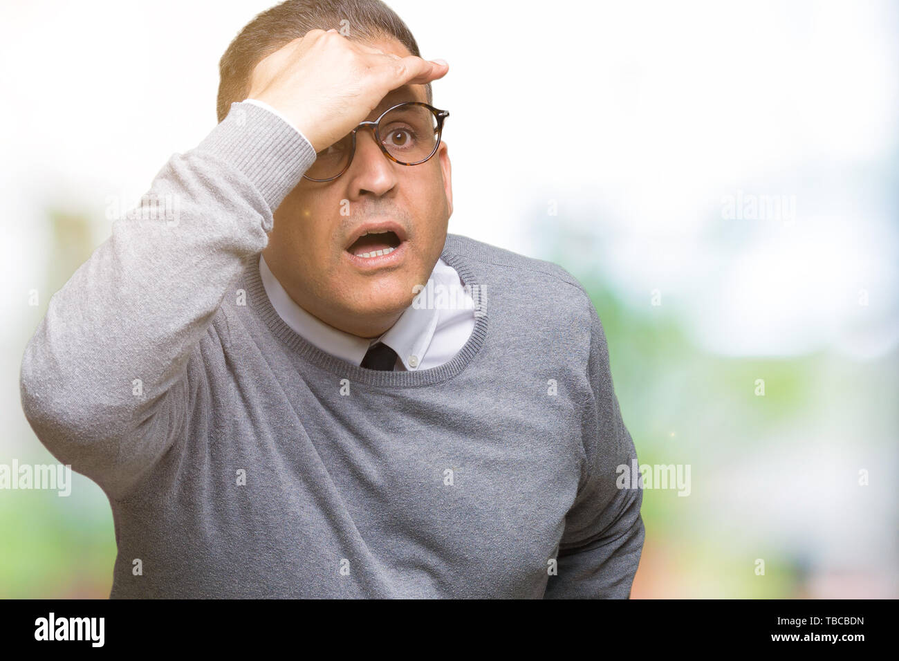 Middle age bussines arab man wearing glasses over isolated background ...