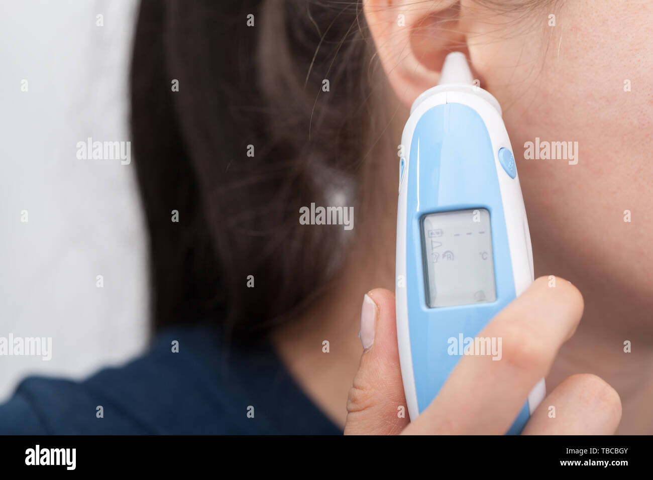 Sick women with a thermometer Stock Photo - Alamy