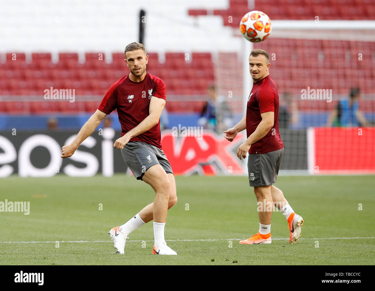 Liverpool's Jordan Henderson (left) and Xherdan Shaqiri during a ...