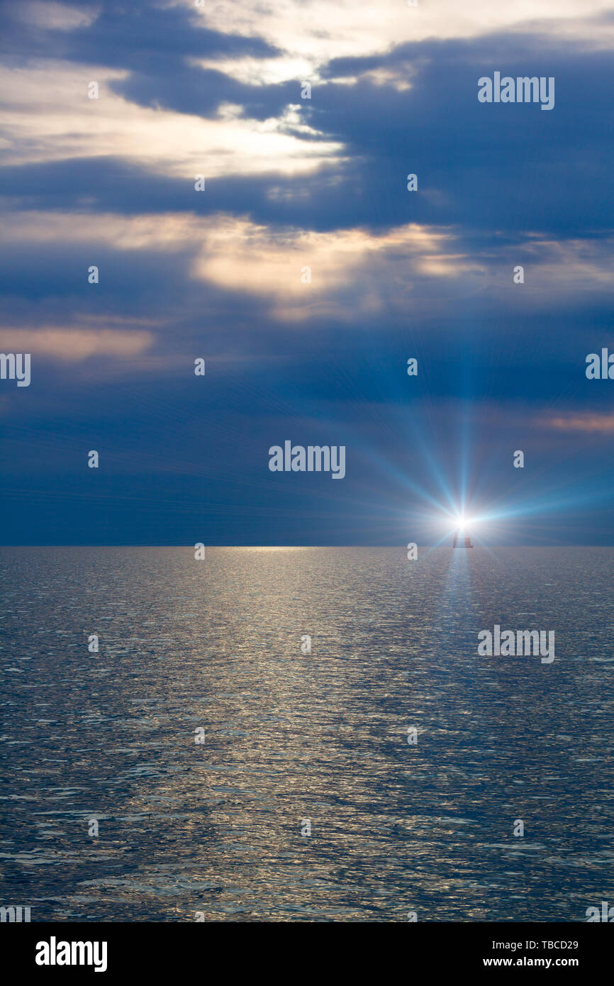 Light of a beacon in the sea Stock Photo - Alamy