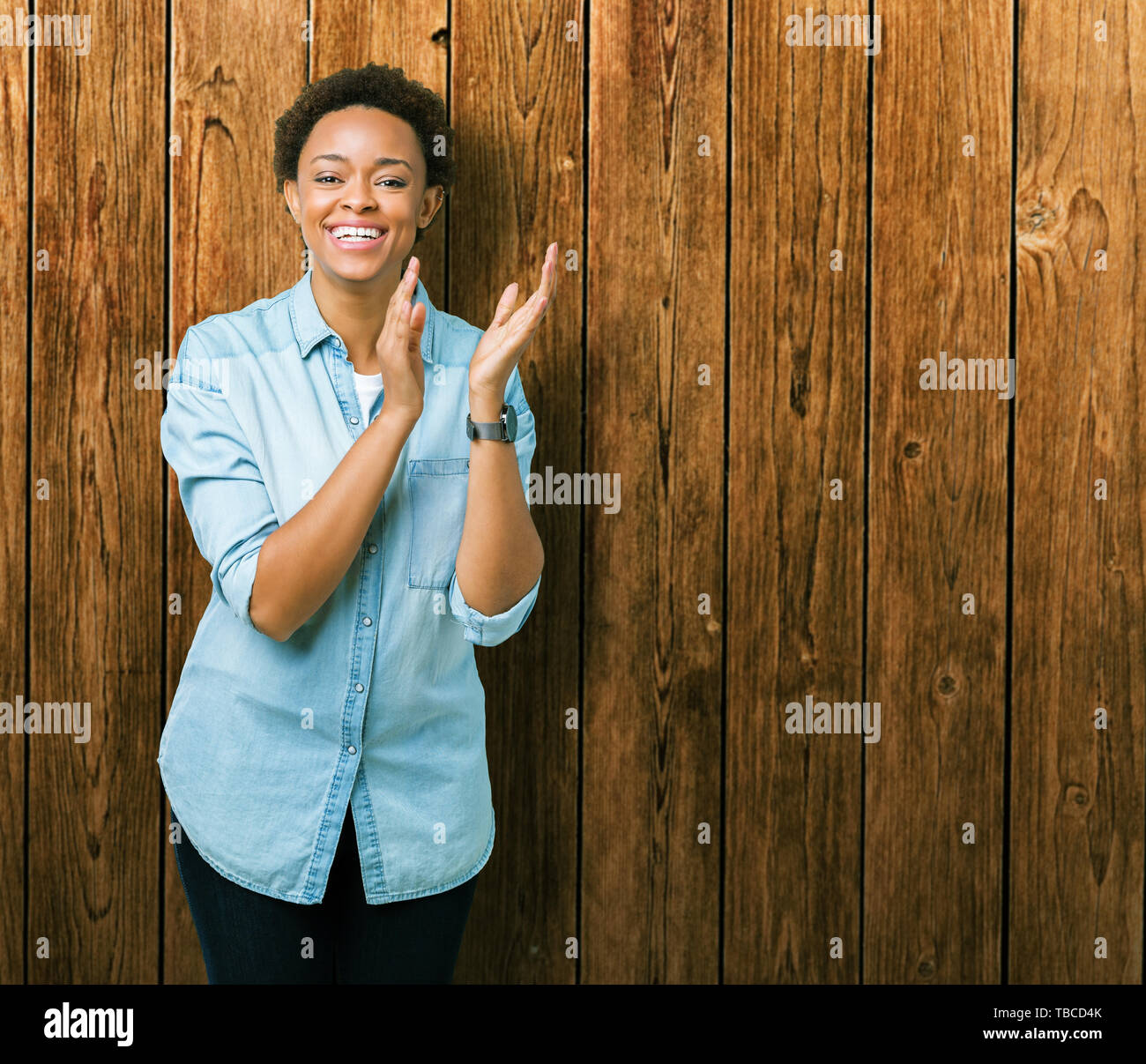 Young beautiful african american woman over isolated background ...