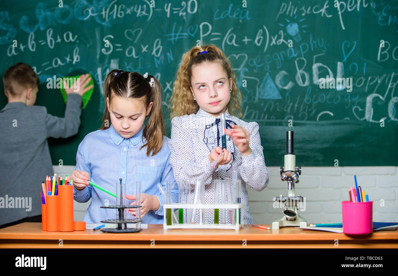 Little girls and boy in lab. Chemistry science. Little kids earning ...