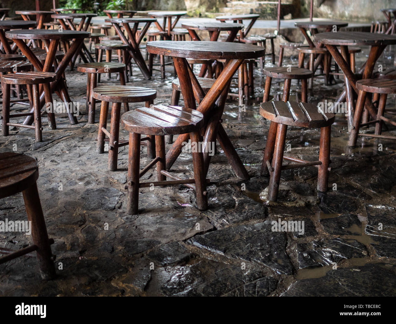 Wooden tables and seats in an outdoor cafe in Vinales, Cuba Stock Photo ...