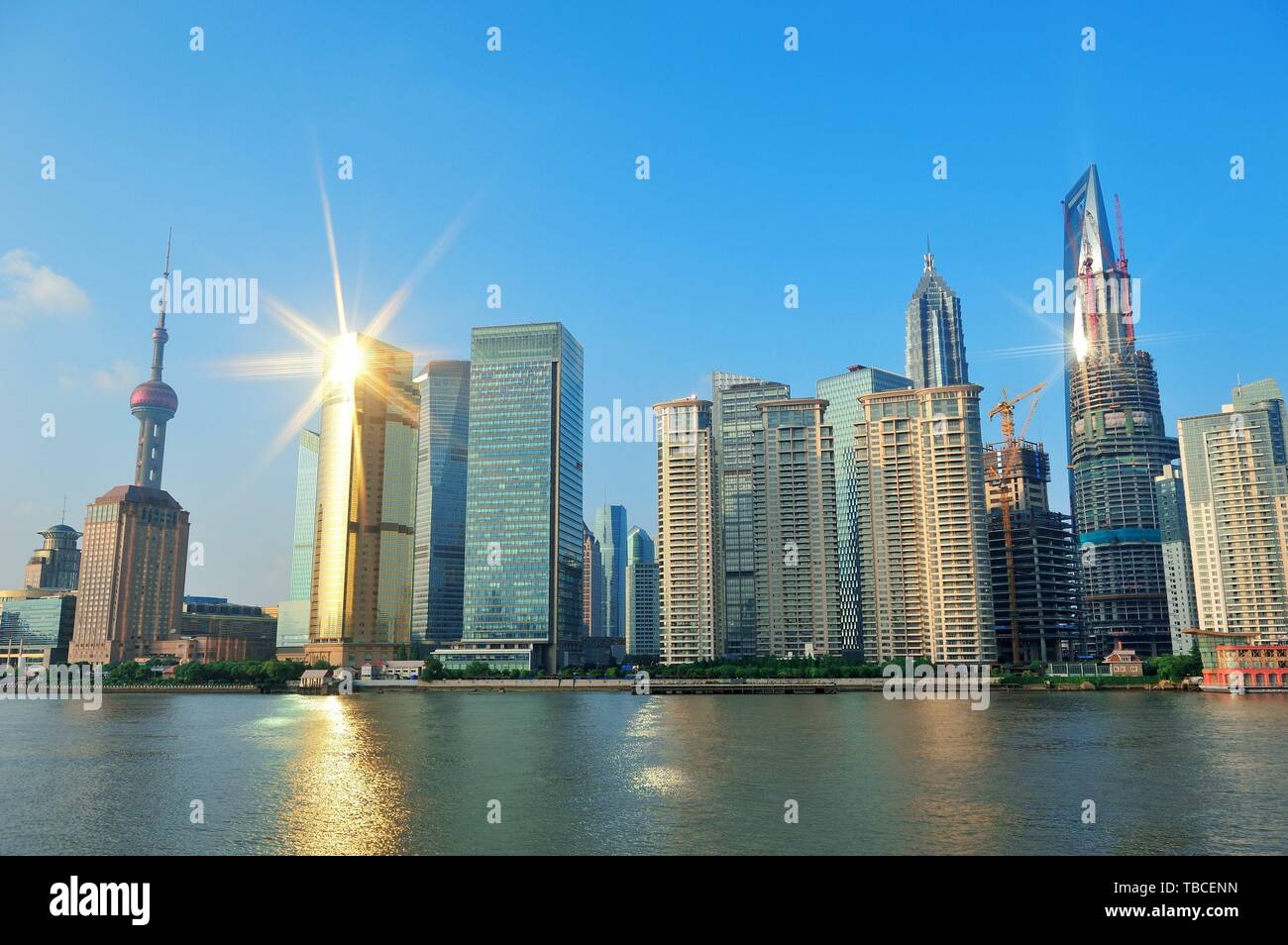 Shanghai urban architecture and skyline with sun light reflection over ...