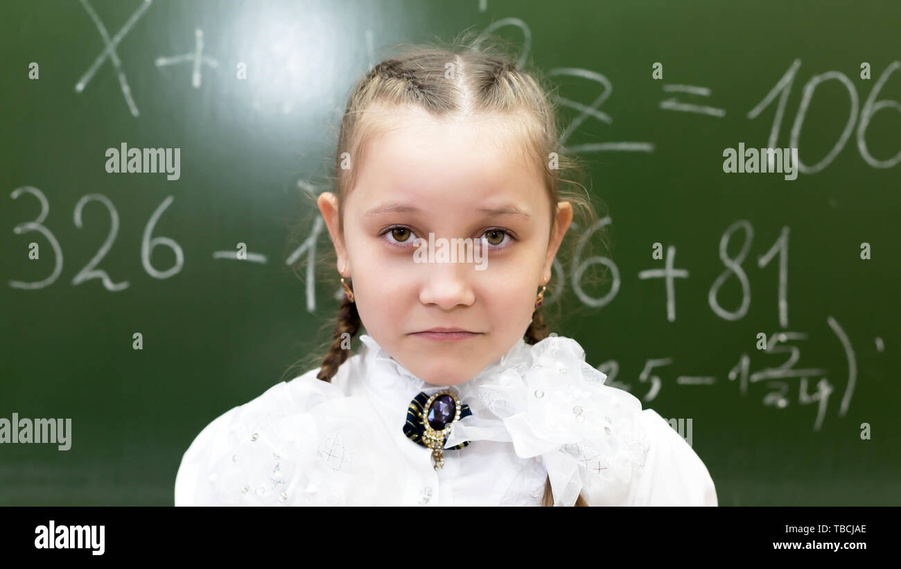 Girl student 10-12 years of age in sadness sad because of a poor ...