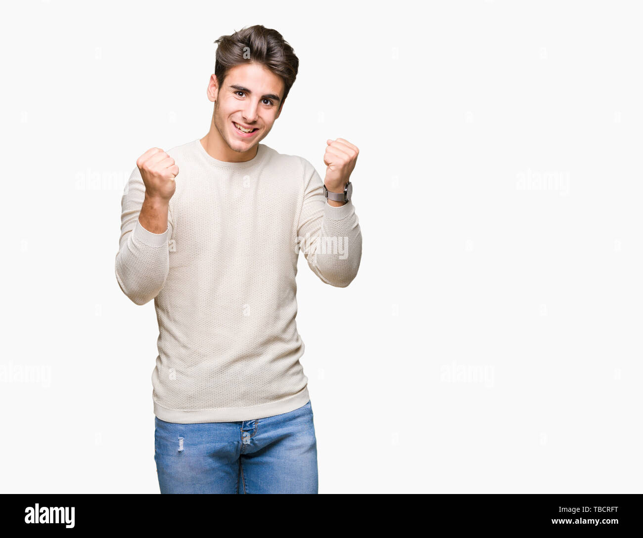 Young handsome man over isolated background celebrating surprised and ...