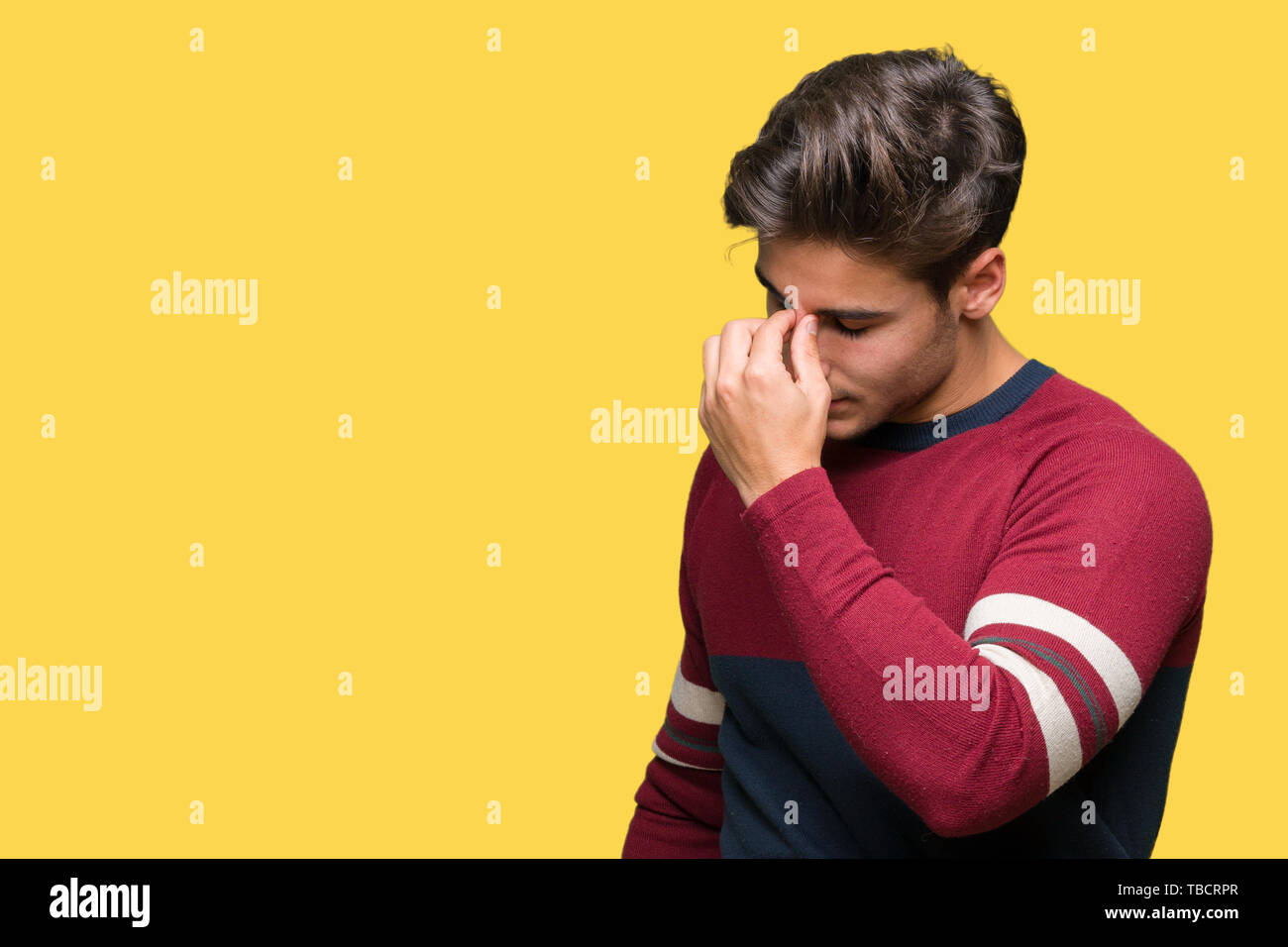 Young handsome man over isolated background tired rubbing nose and eyes ...