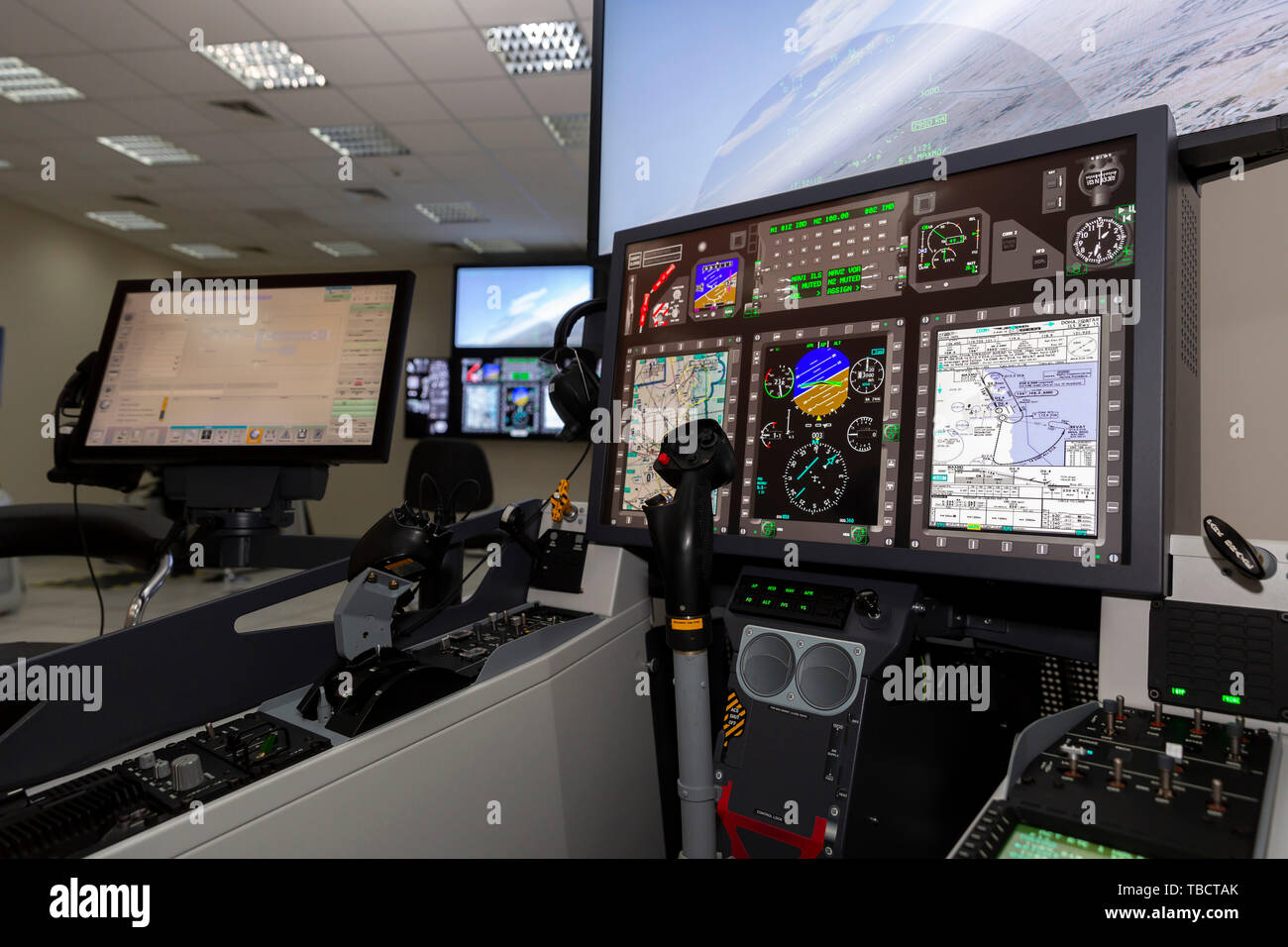 Fighter aircraft simulator training room. A flight simulator is a ...
