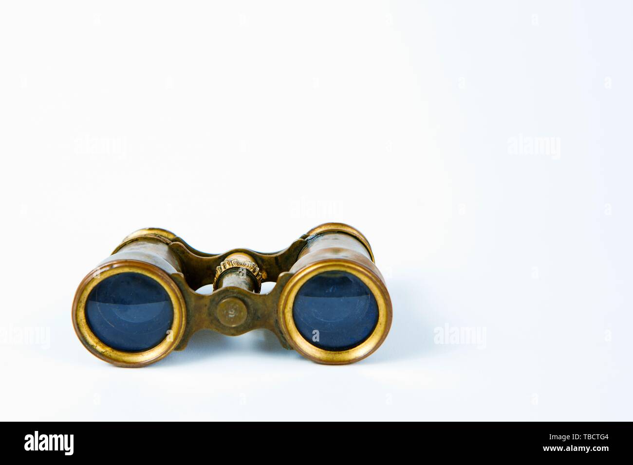 Vintage classical brass binoculars on white background, front view ...