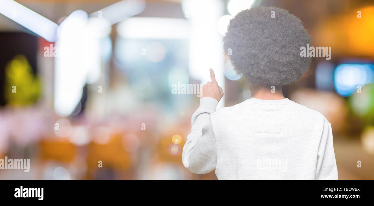 Young african american man with afro hair wearing sporty sweatshirt ...