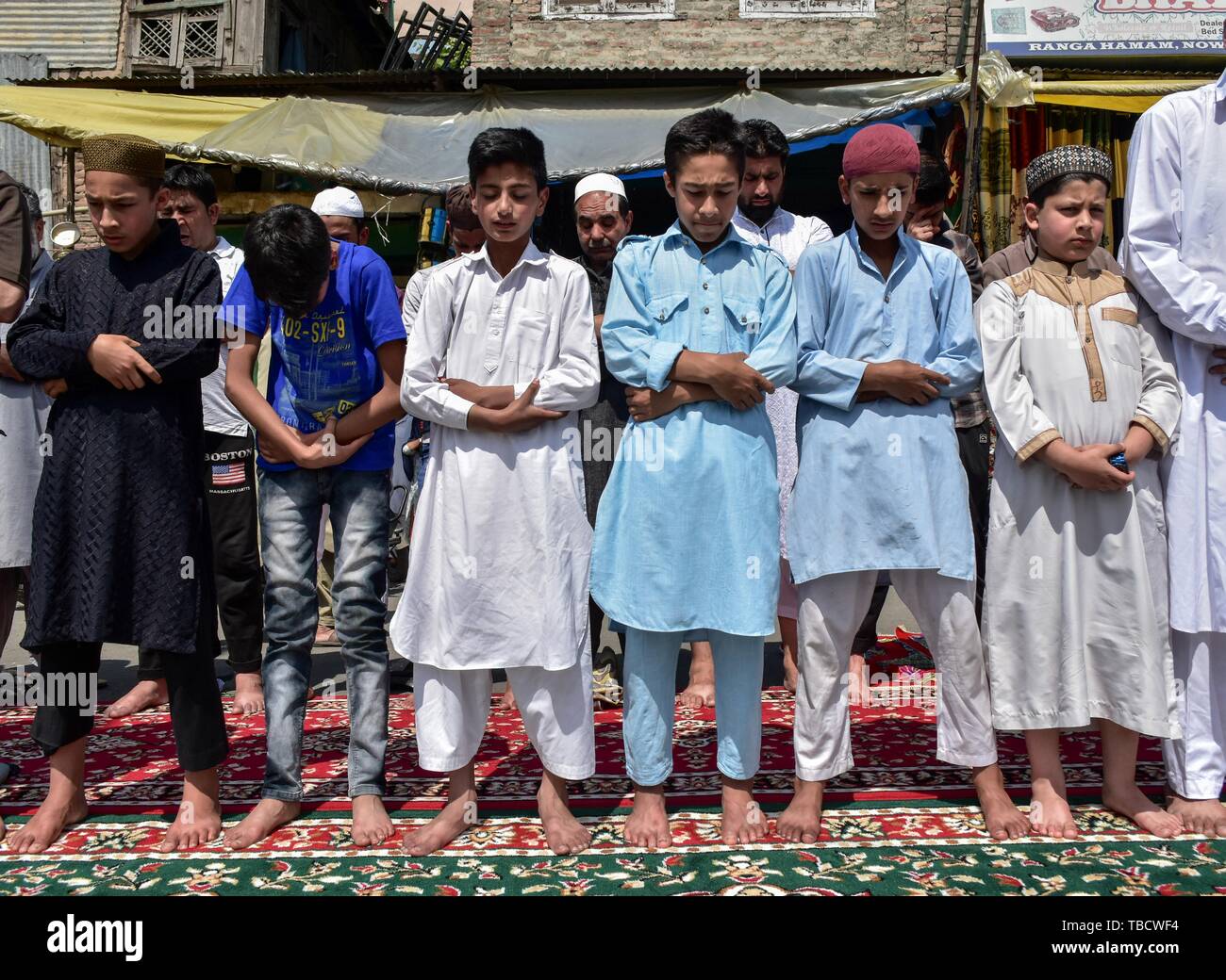 Kashmiri Muslims offer prayers outside the historic Grand Mosque or ...