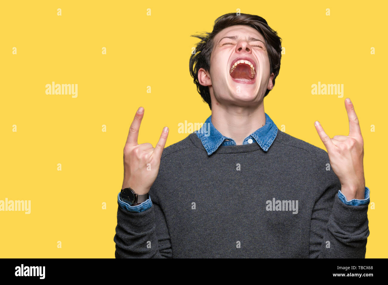 Young handsome elegant man over isolated background shouting with crazy ...
