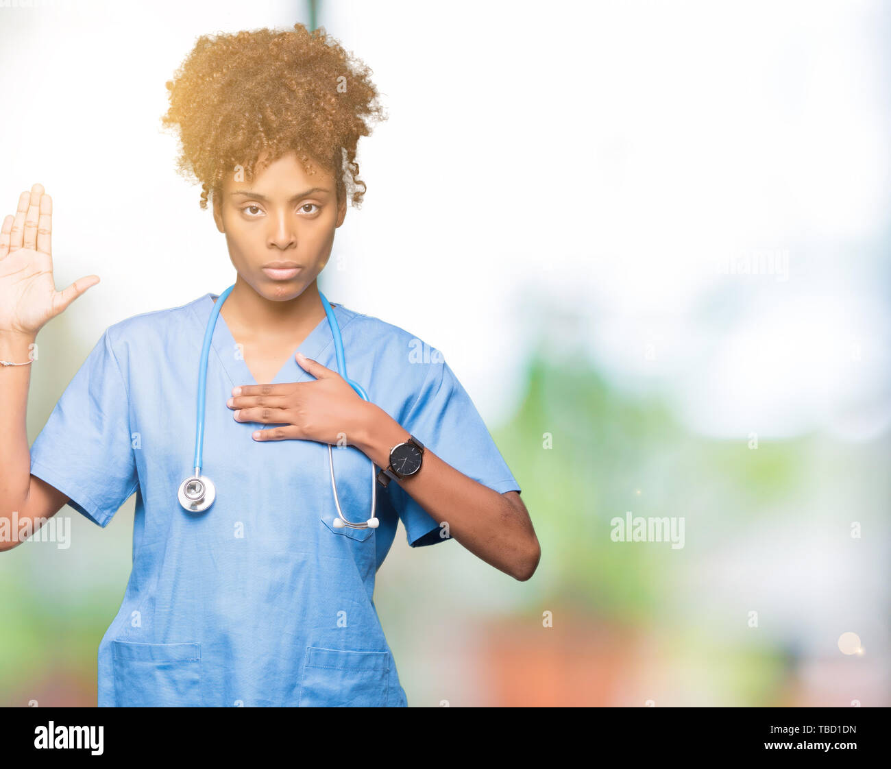 Young african american doctor woman over isolated background Swearing ...