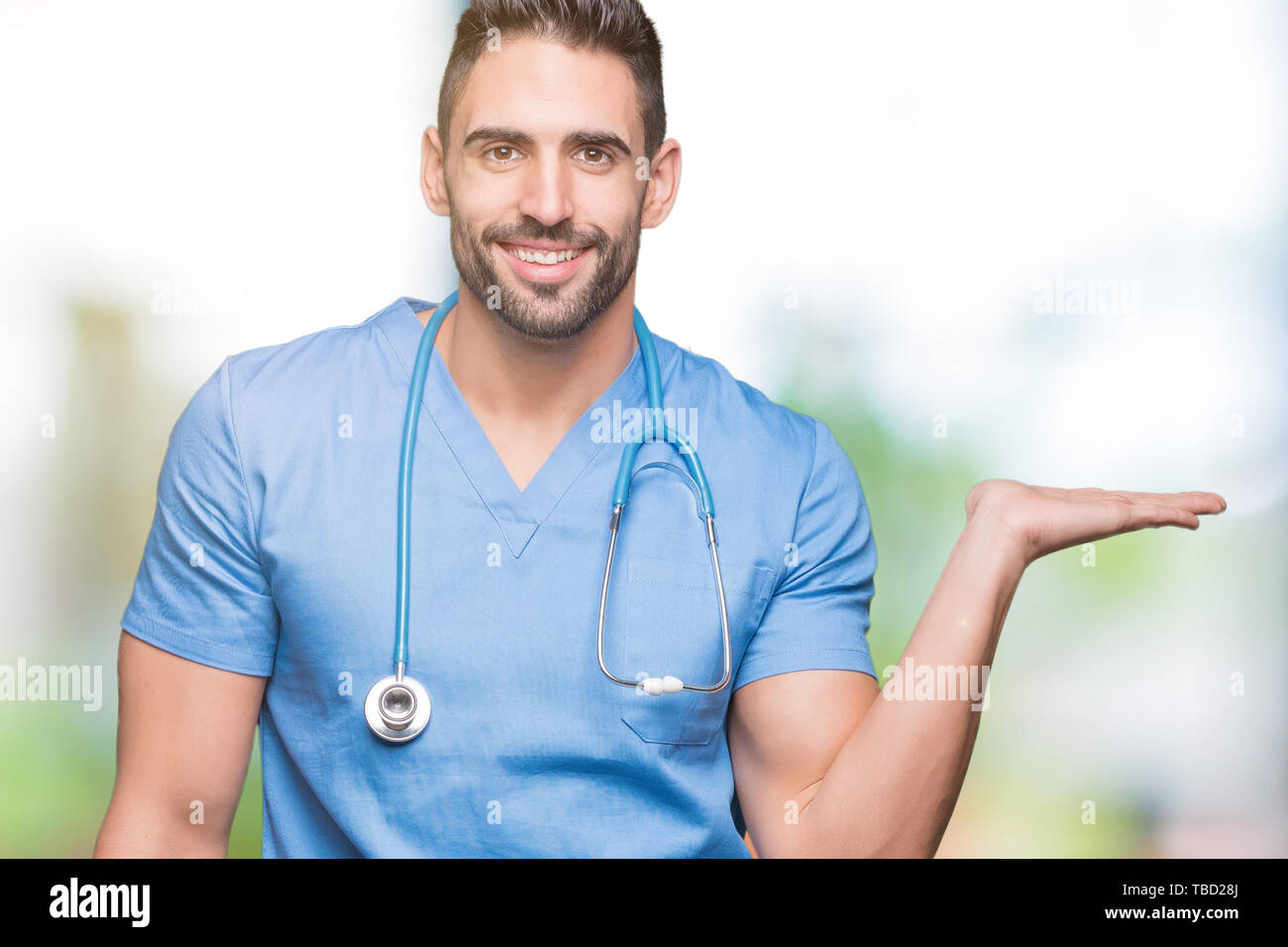 Handsome young doctor surgeon man over isolated background smiling ...