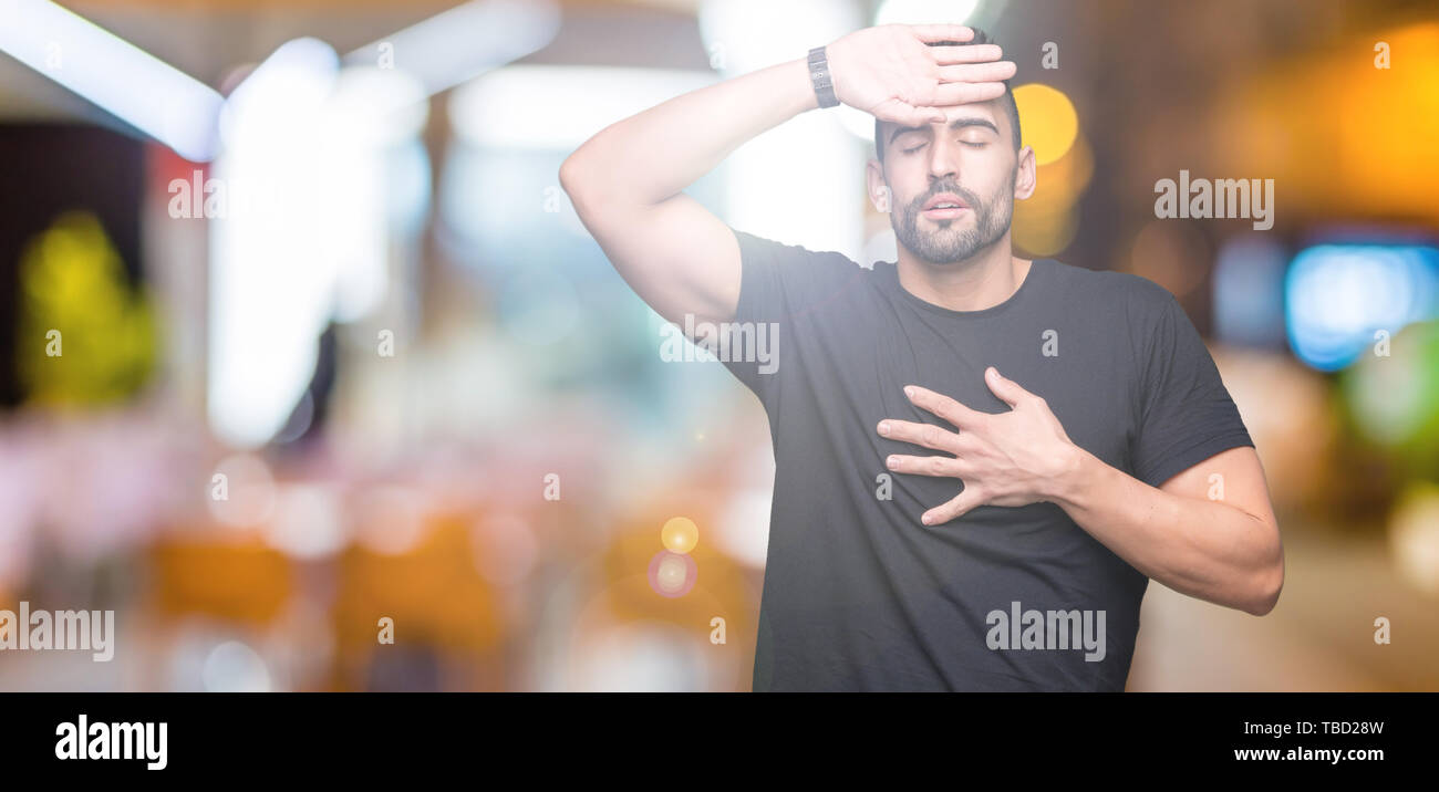 Young handsome man over isolated background Touching forehead for ...