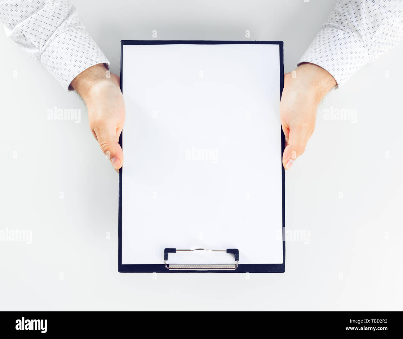 Clipboard on a white table. close up Stock Photo - Alamy