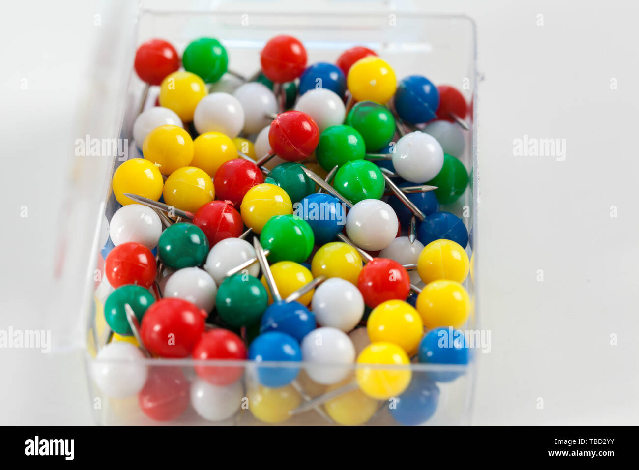 colorful color push pins isolated on white background Stock Photo - Alamy