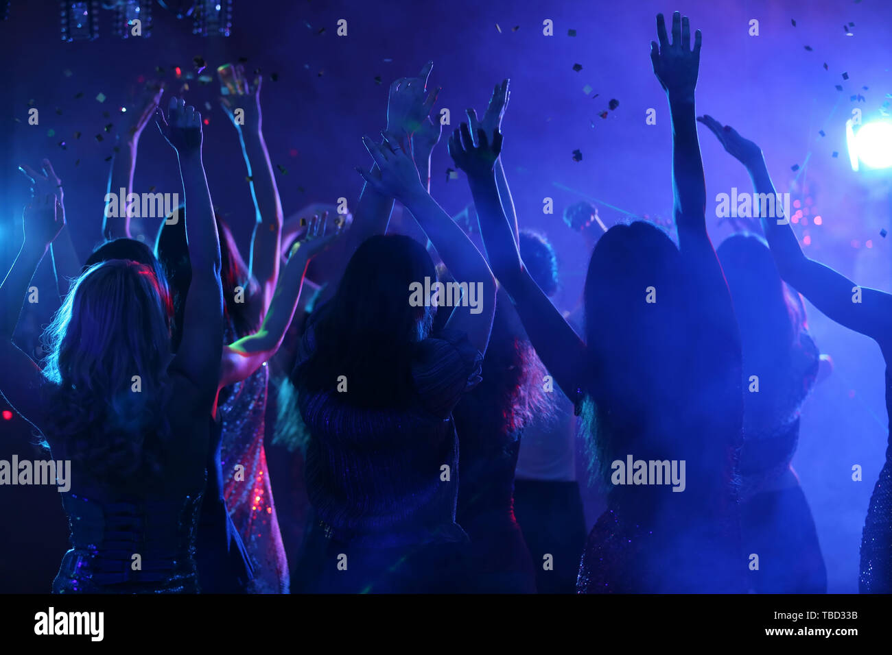 Beautiful young women dancing in night club Stock Photo - Alamy