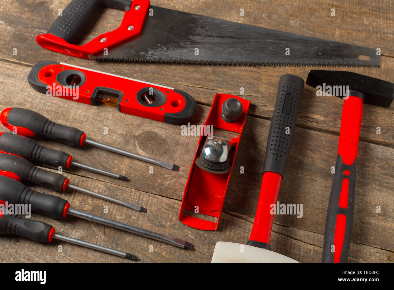 Assorted work tools on wood background Stock Photo - Alamy