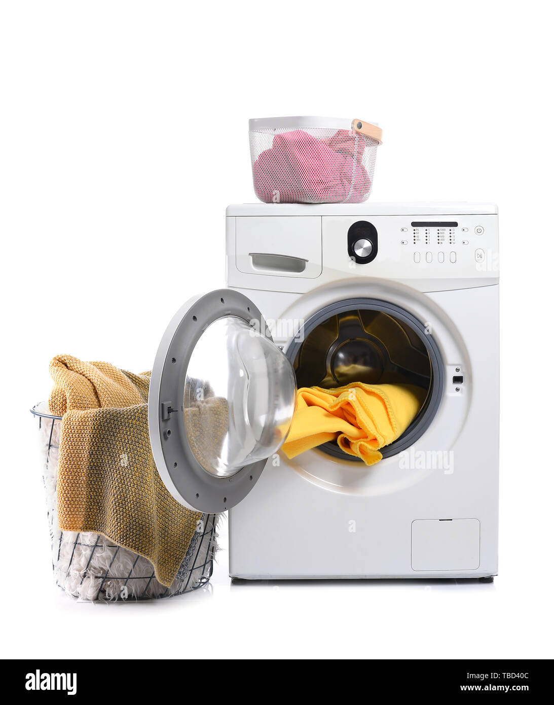 Modern washing machine and laundry on white background Stock Photo - Alamy