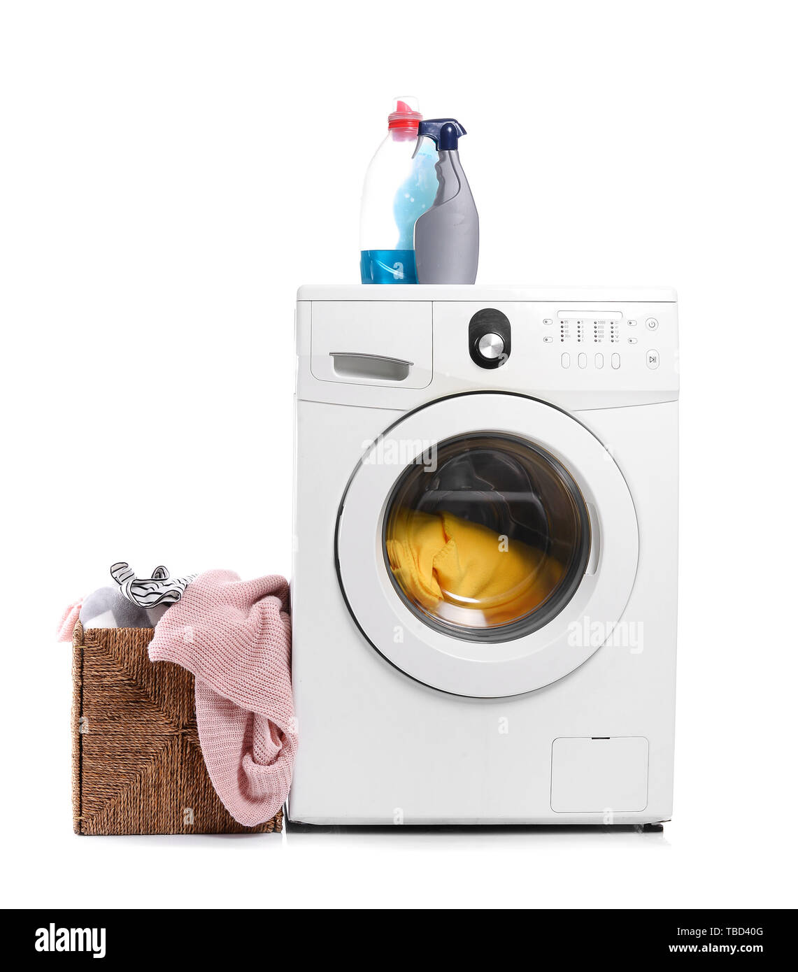 Modern washing machine and laundry on white background Stock Photo - Alamy