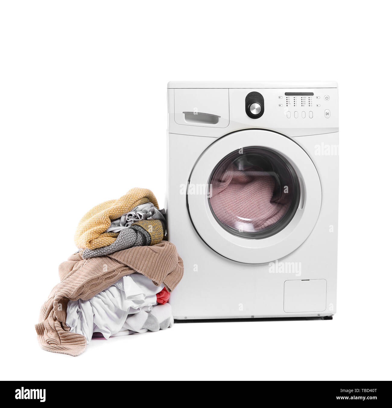 Modern washing machine and laundry on white background Stock Photo - Alamy