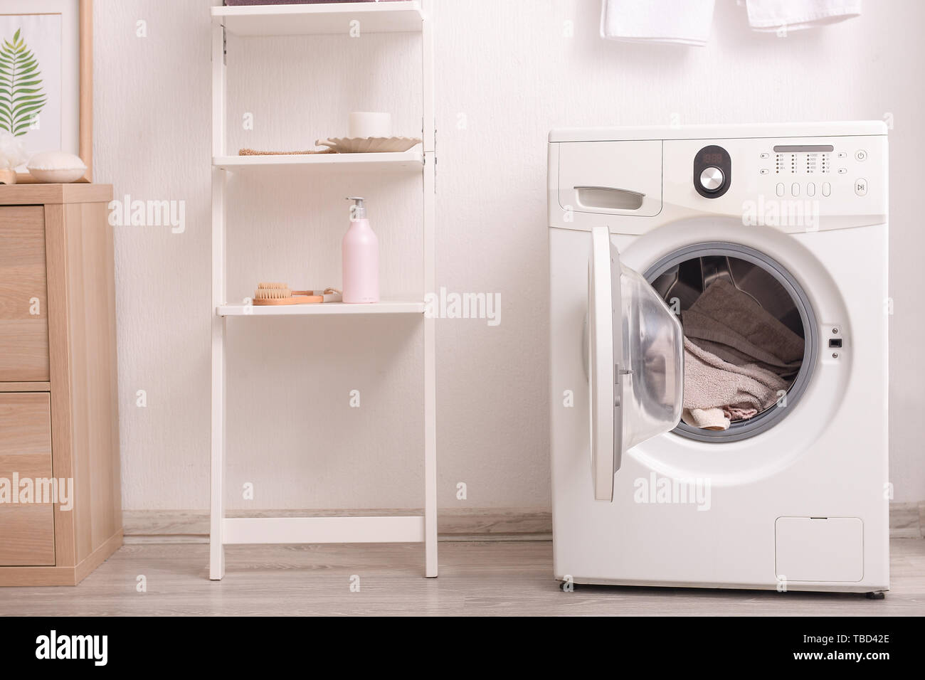 Interior of home laundry room with modern washing machine Stock Photo ...