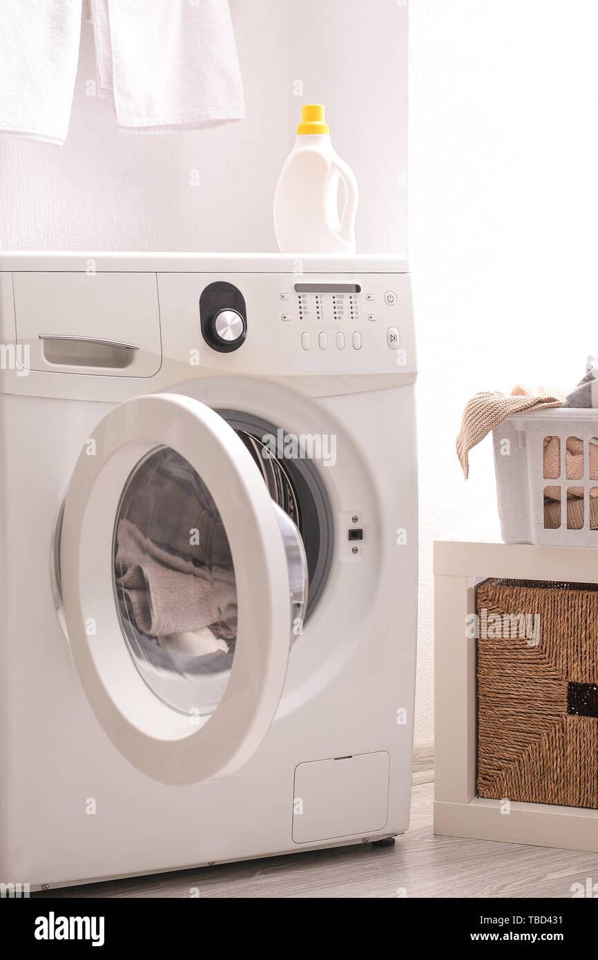 Modern washing machine in bathroom Stock Photo - Alamy