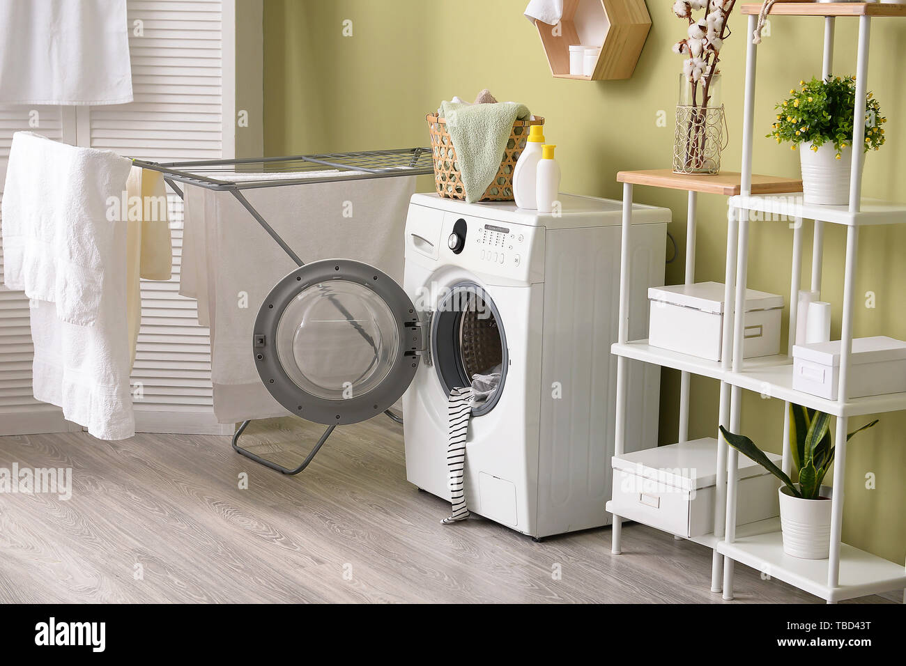 Interior of home laundry room with modern washing machine Stock Photo ...