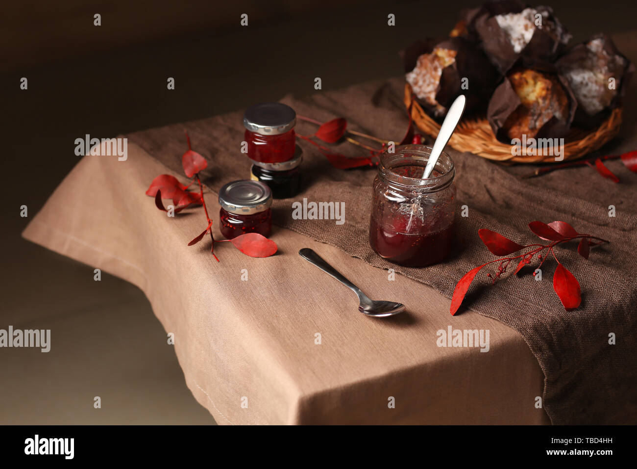 Jars of tasty jams on table Stock Photo - Alamy