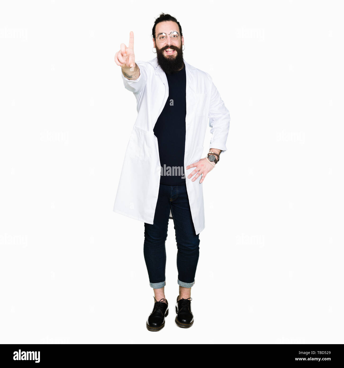 Doctor therapist man with long hair and bear wearing white coat showing ...