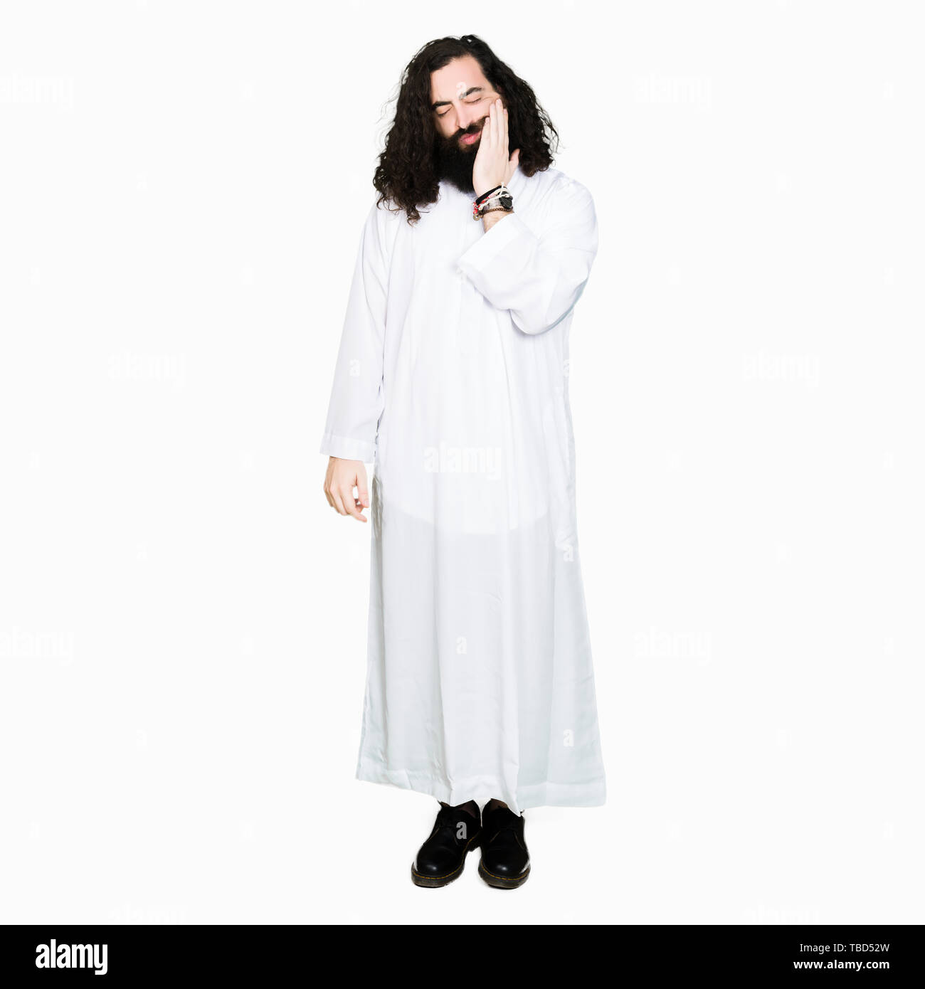 Man wearing Jesus Christ costume touching mouth with hand with painful ...