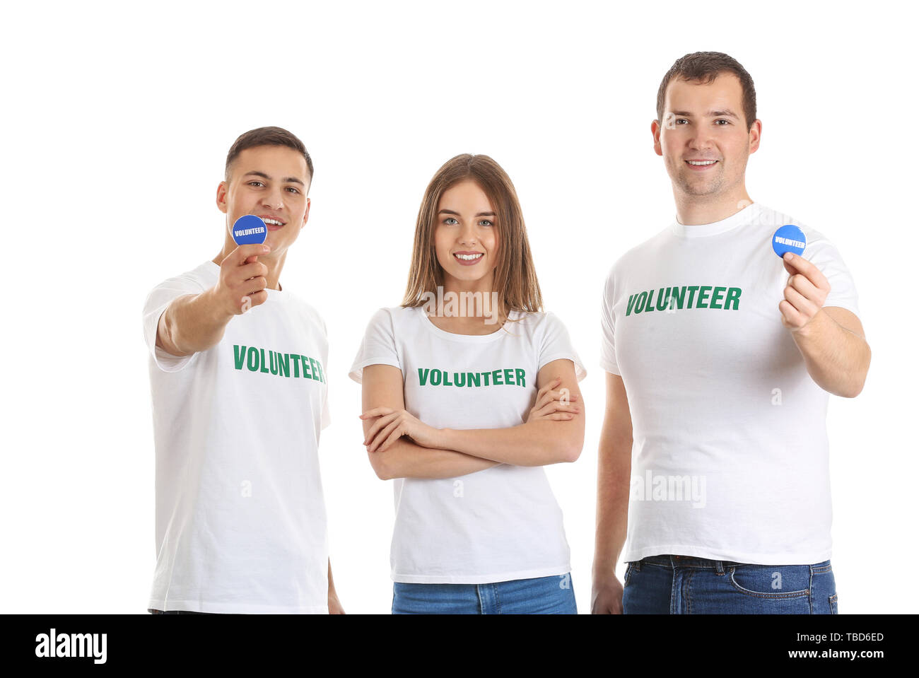 Team of young volunteers on white background Stock Photo - Alamy