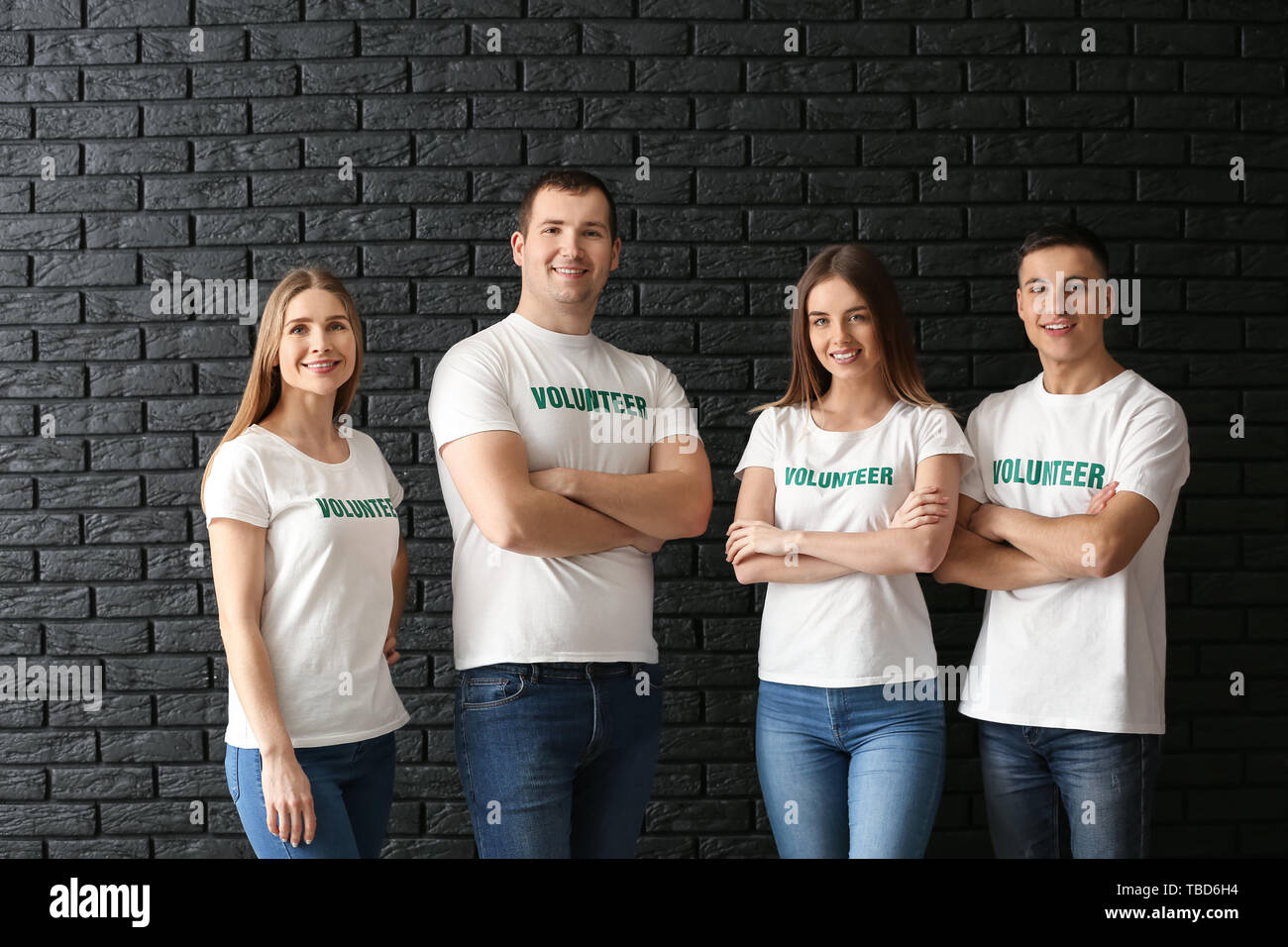 Team of young volunteers hi-res stock photography and images - Alamy