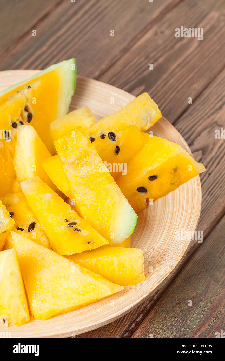 Slice yellow watermelon Stock Photo - Alamy