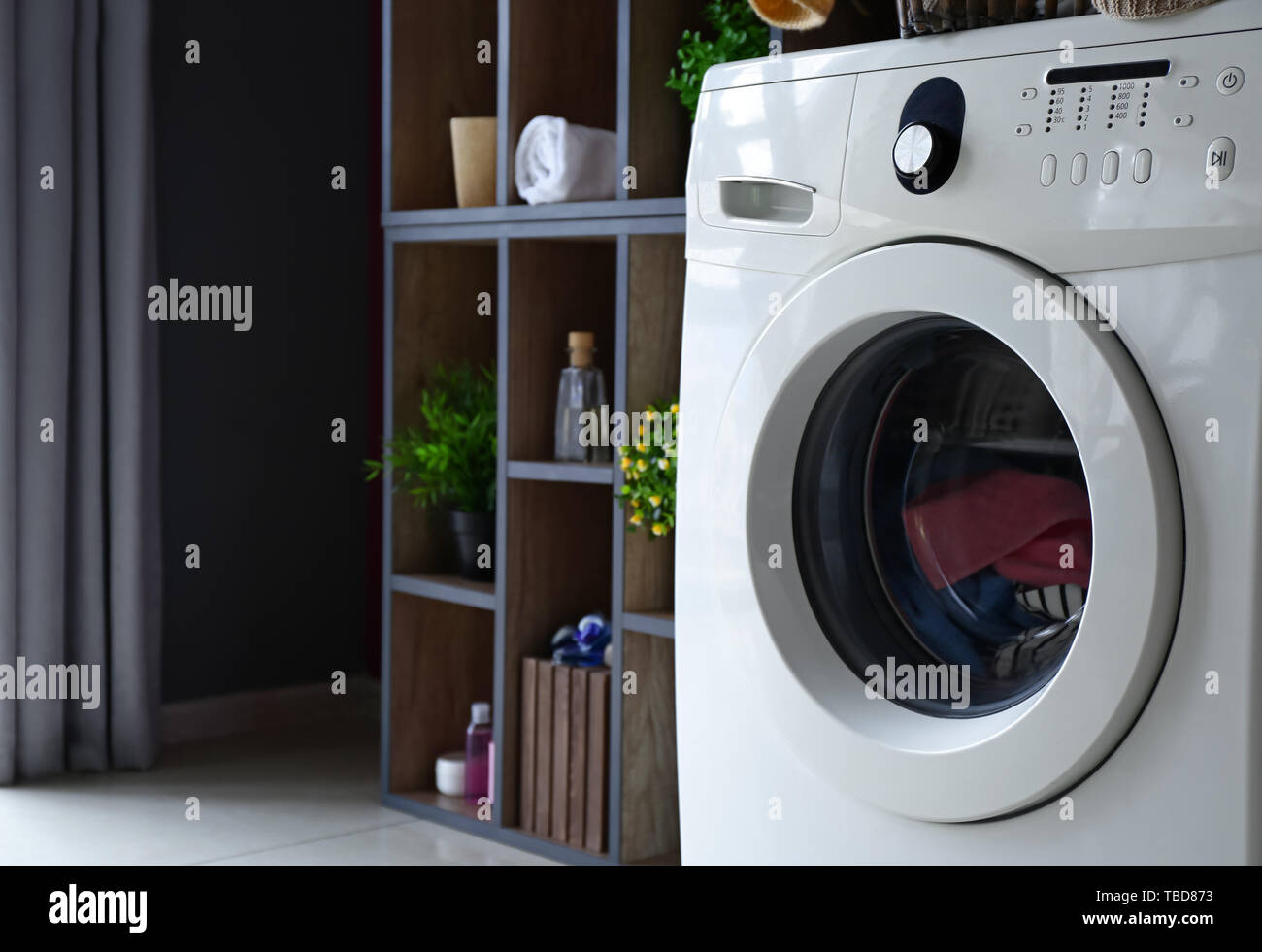 Washing machine in modern home laundry room Stock Photo - Alamy