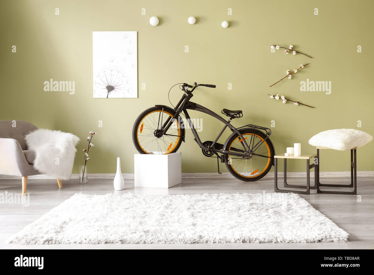 Modern bicycle in interior of living room Stock Photo - Alamy