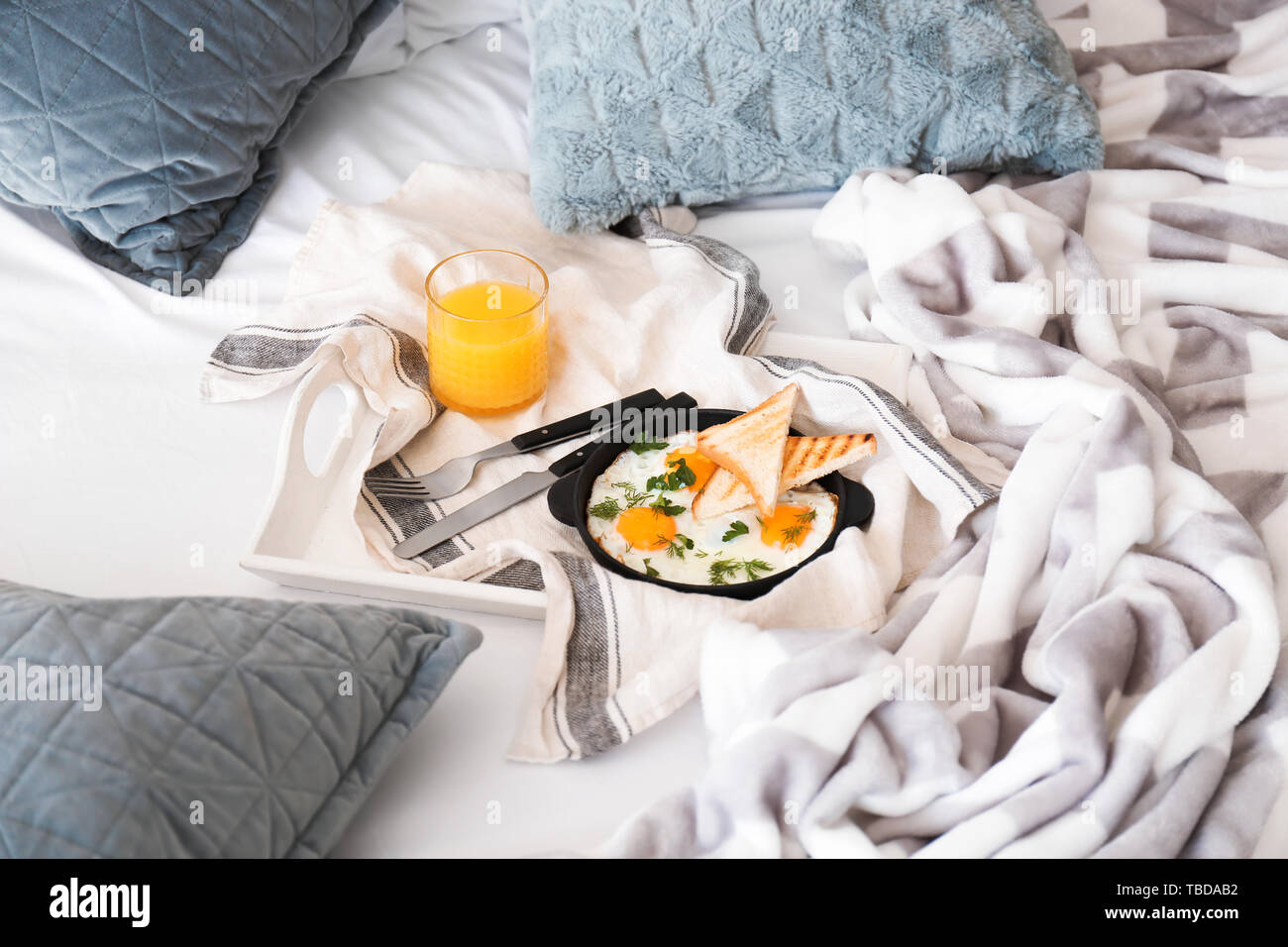 Tasty healthy breakfast on bed Stock Photo - Alamy