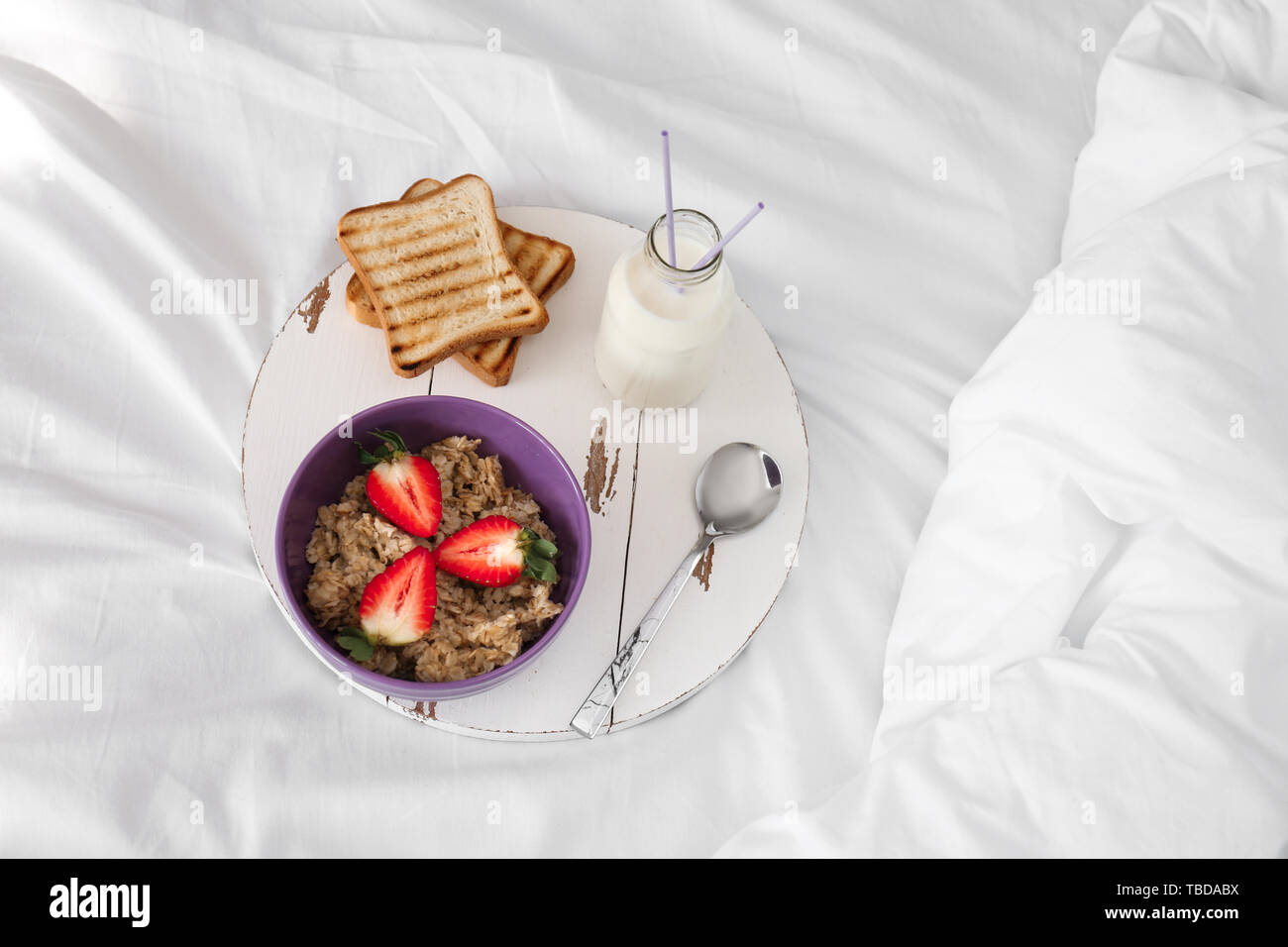 Tasty healthy breakfast on bed Stock Photo - Alamy