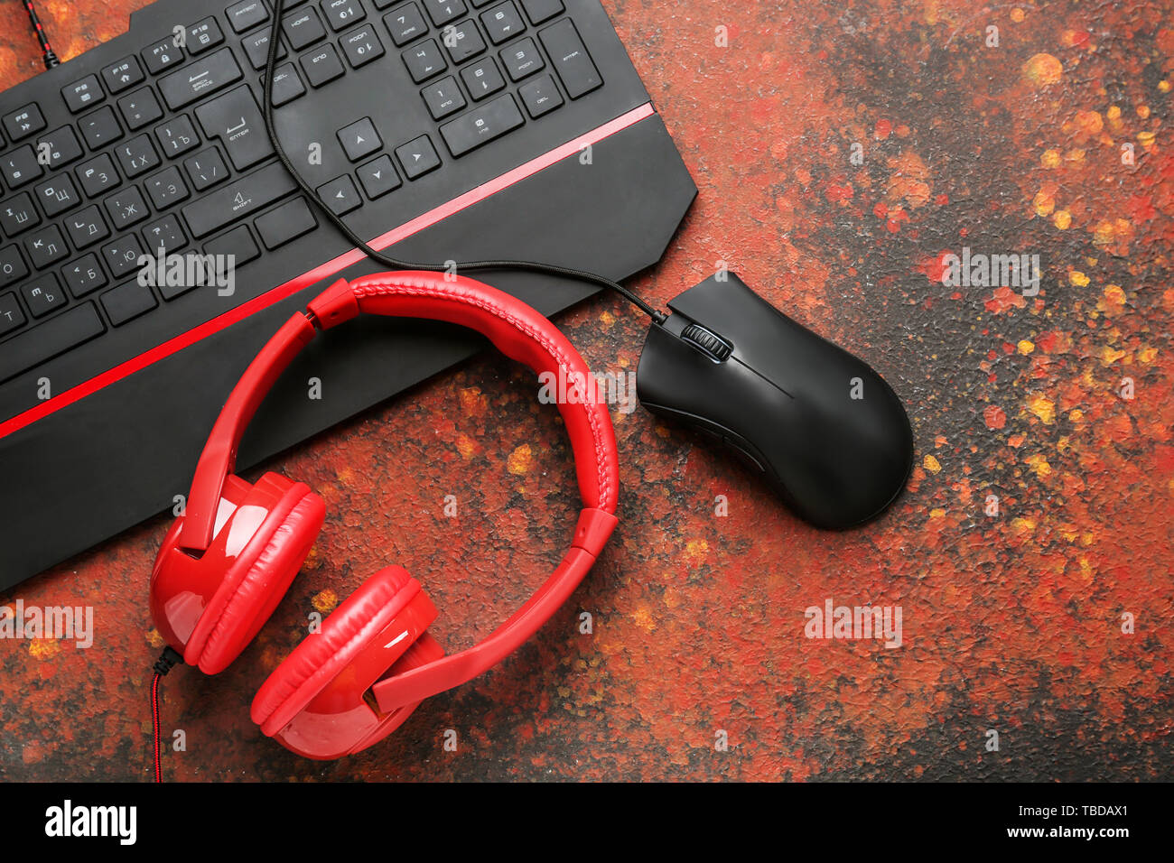 Modern gaming keyboard, mouse and headphones on grunge background Stock ...