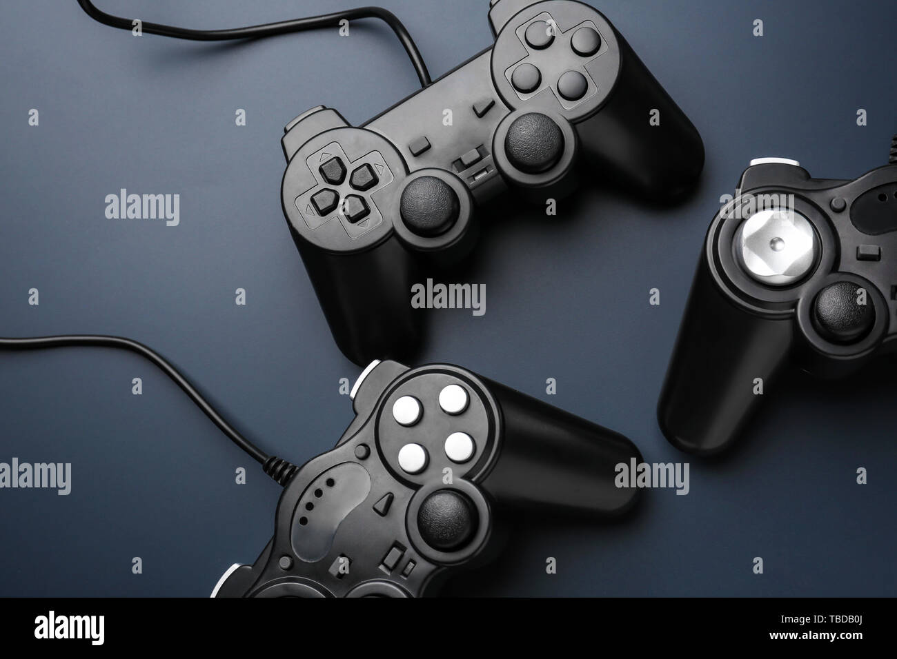 Modern game pads on dark background Stock Photo - Alamy
