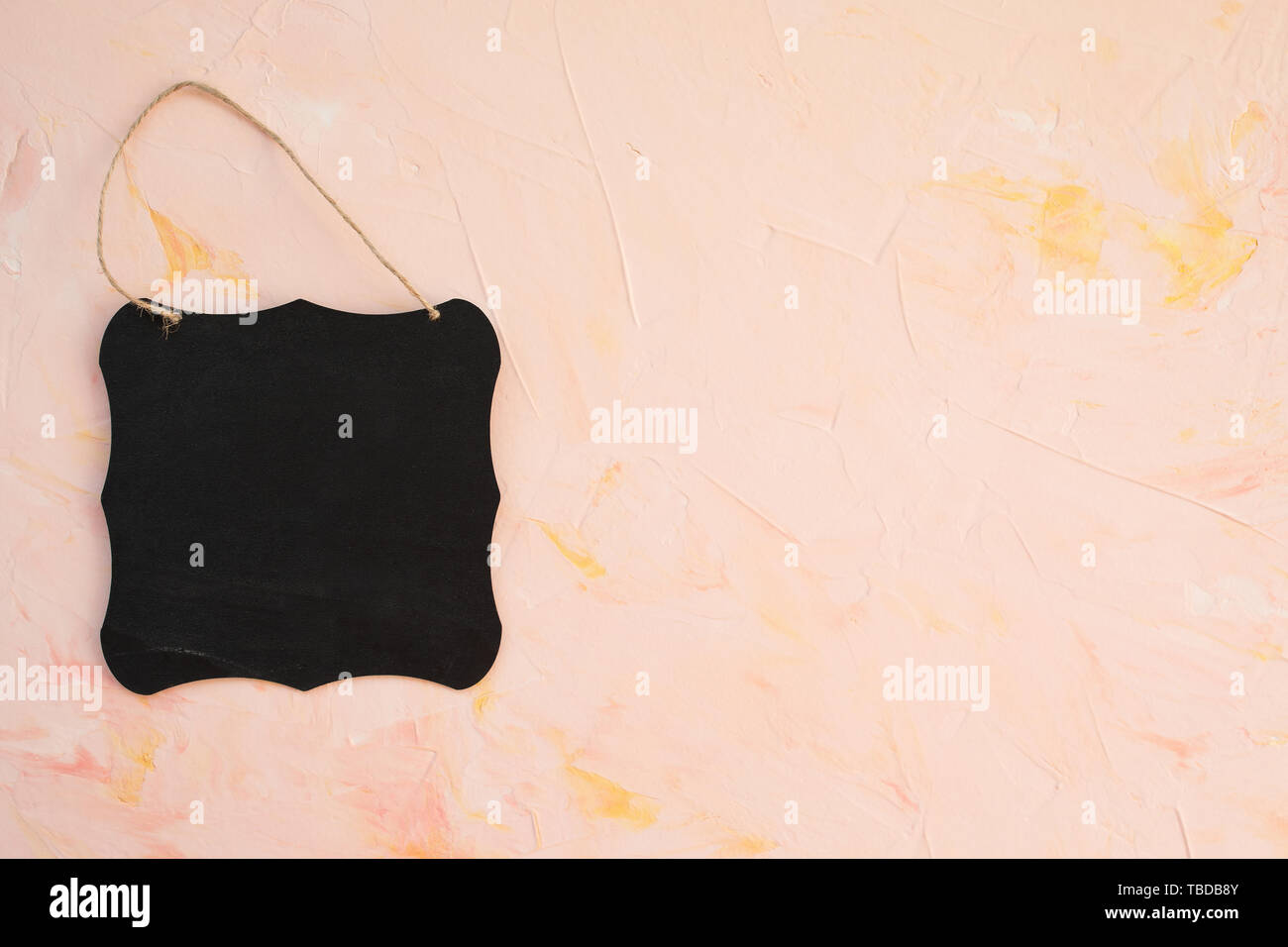 Empty blackboard on a pink background. Cooking, menu, groceries and ...
