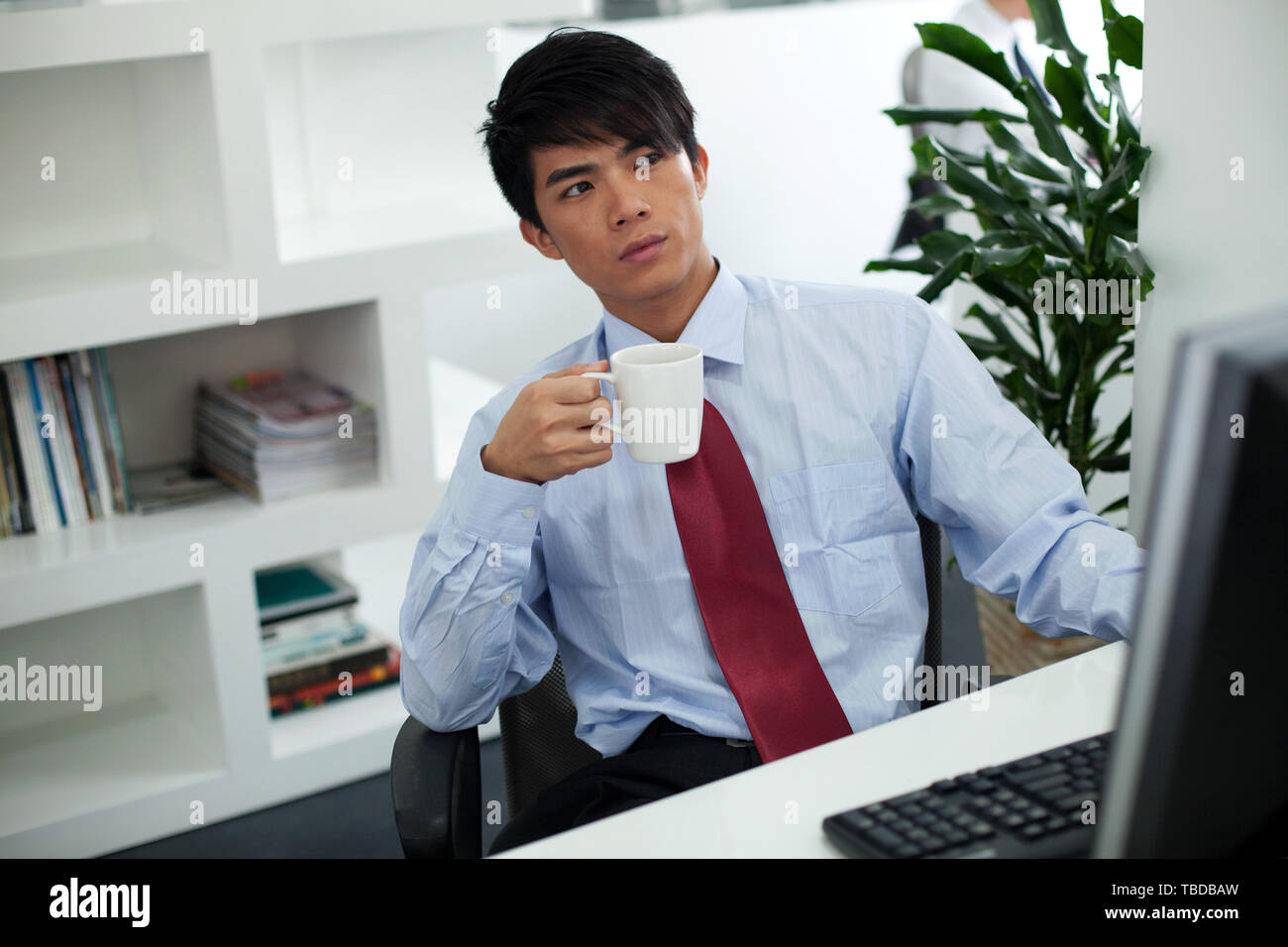 A white-collar man in front of a computer Stock Photo - Alamy