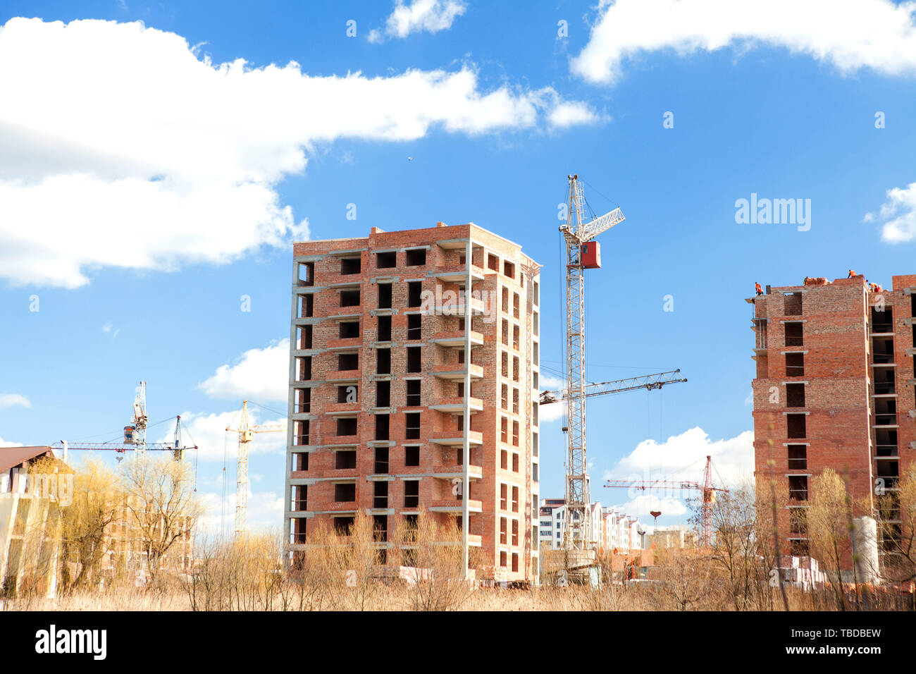 High-rise multi-storey buildings under construction. Tower cranes near ...
