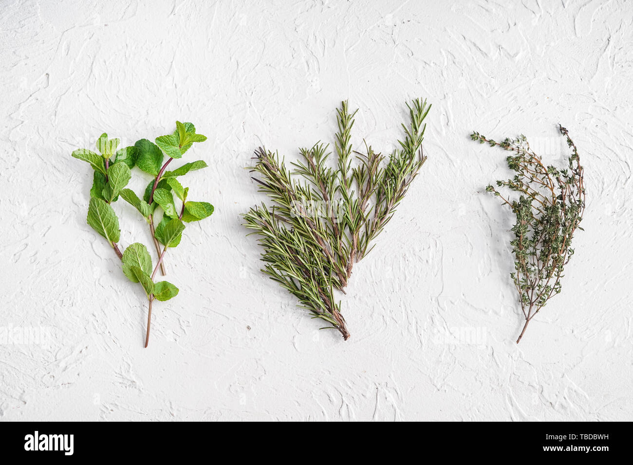 Bunches of aromatic herbs on white background Stock Photo - Alamy