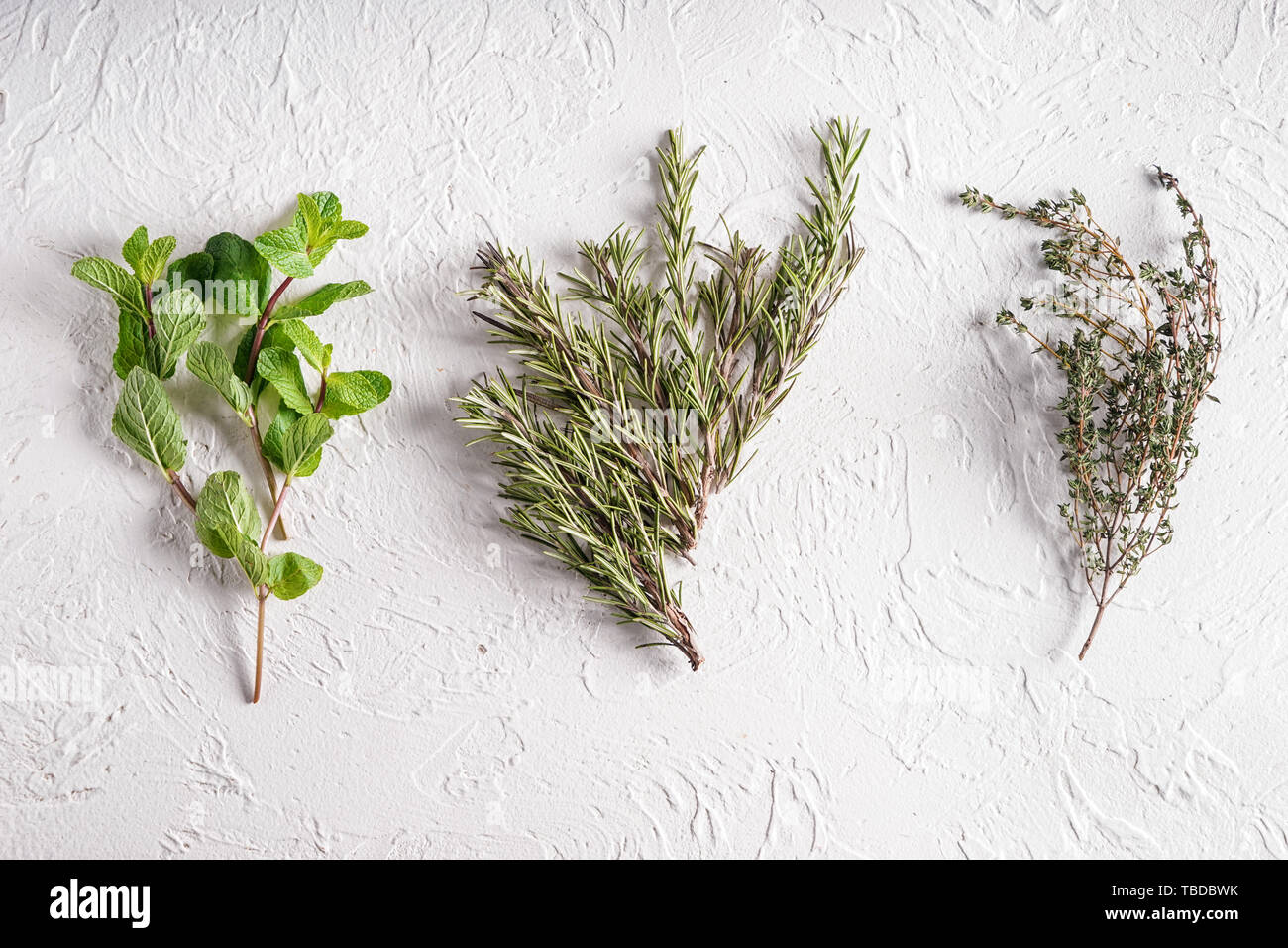 Bunches of aromatic herbs on white background Stock Photo - Alamy