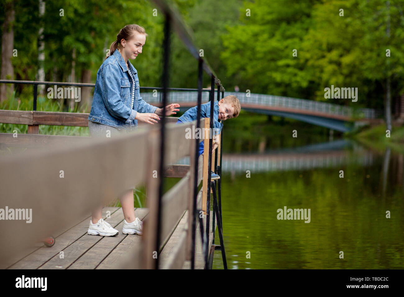 Mother is experiencing that the child will fall into the water. A ...