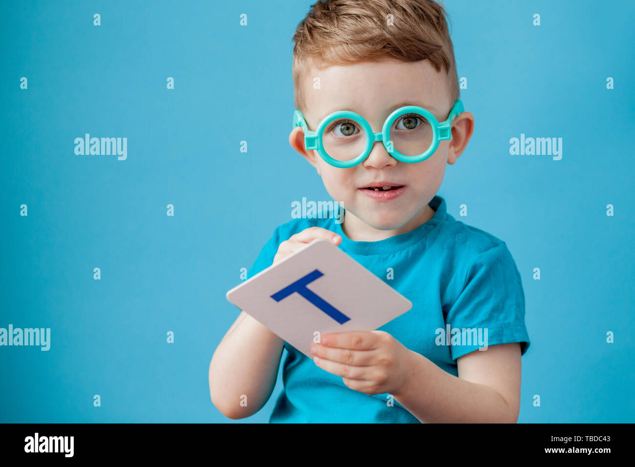 Cute Little Boy With Letter On Background Child Learn Letters cute-little-boy-with-letter-on-background-child-learn-letters