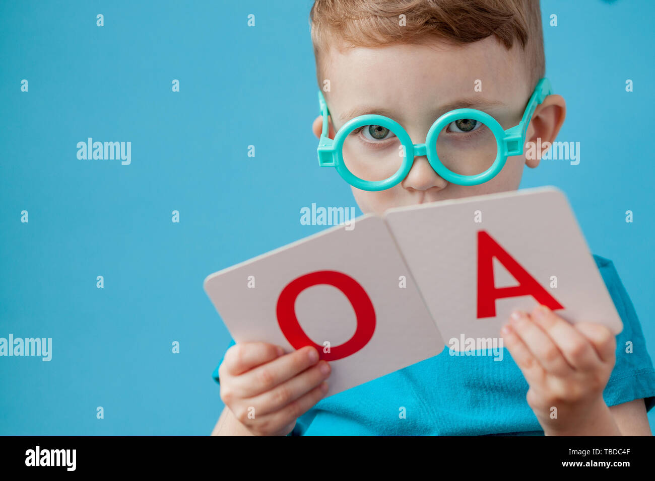 Cute little boy with letter on background. Child learn letters ...