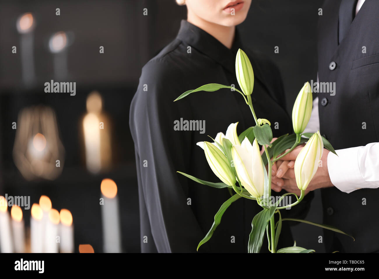 Sad couple mourning after funeral hi-res stock photography and images ...
